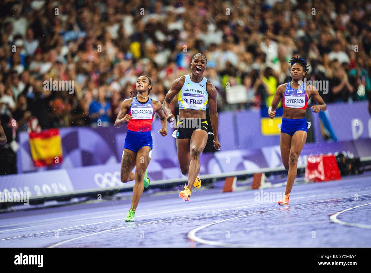 Julien Alfred winning in the 100 meters relay at the Paris 2024 Olympic ...