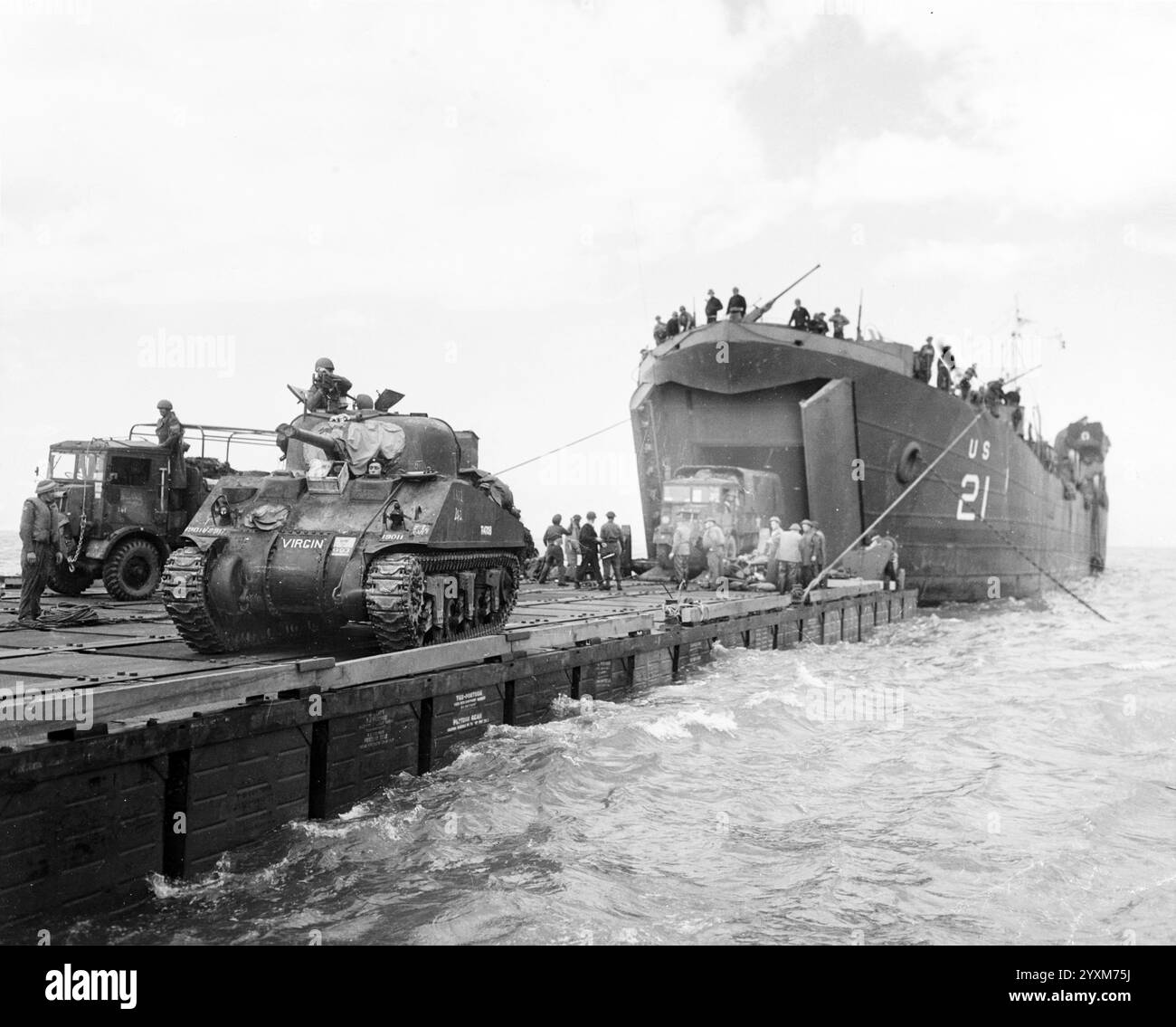 The U.S. Coast Guard manned USS LST-21 unloads British Army tanks and ...