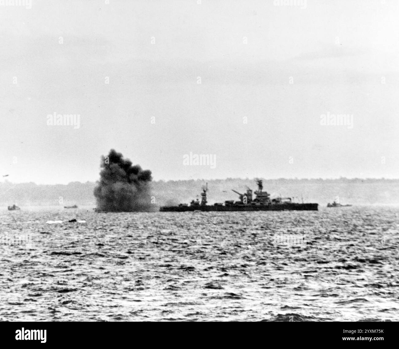 USS Arkansas (BB-33) fires her 12-inch guns at German positions, while ...
