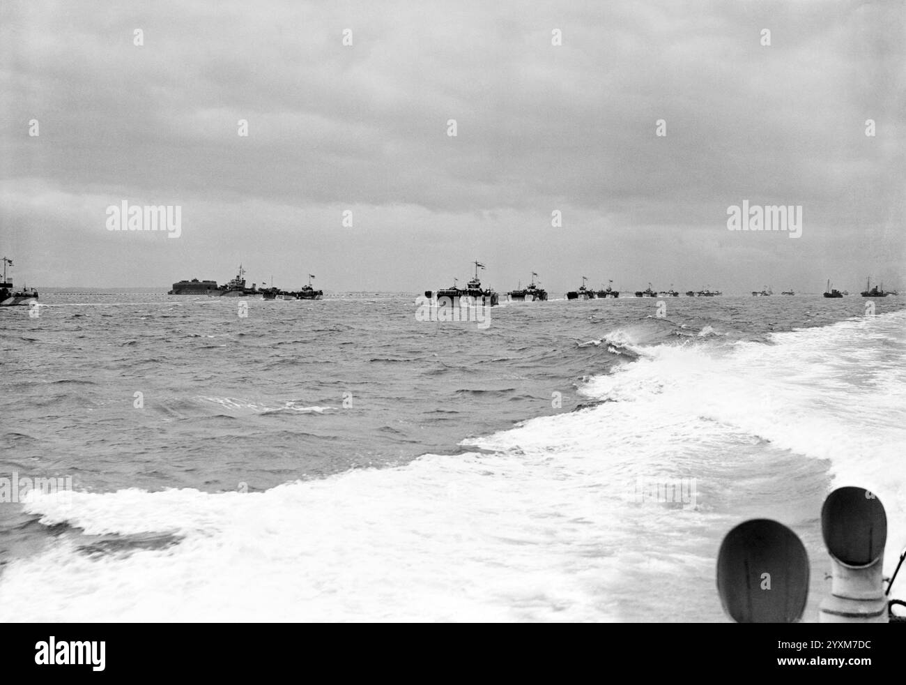 Lines of landing craft and other ships in the English Channel, part of ...