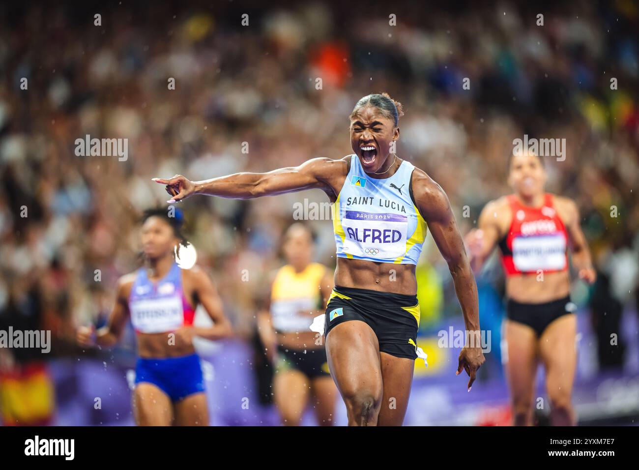 Julien Alfred winning in the 100 meters relay at the Paris 2024 Olympic ...
