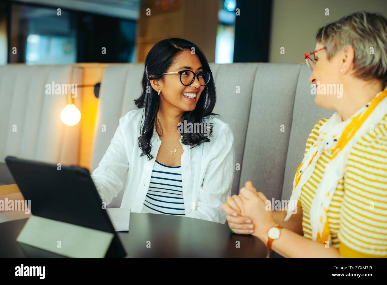 A joyful interaction between a professor and PHD student sharing ideas ...
