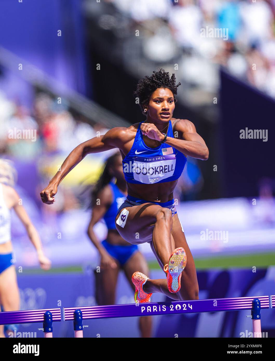 Anna Cockrell participating in the 400 meters hurdles at the Paris 2024 ...