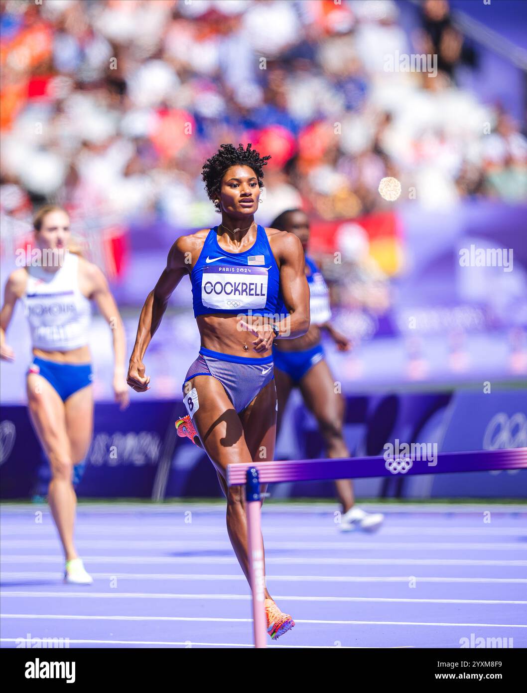 Anna Cockrell participating in the 400 meters hurdles at the Paris 2024 ...