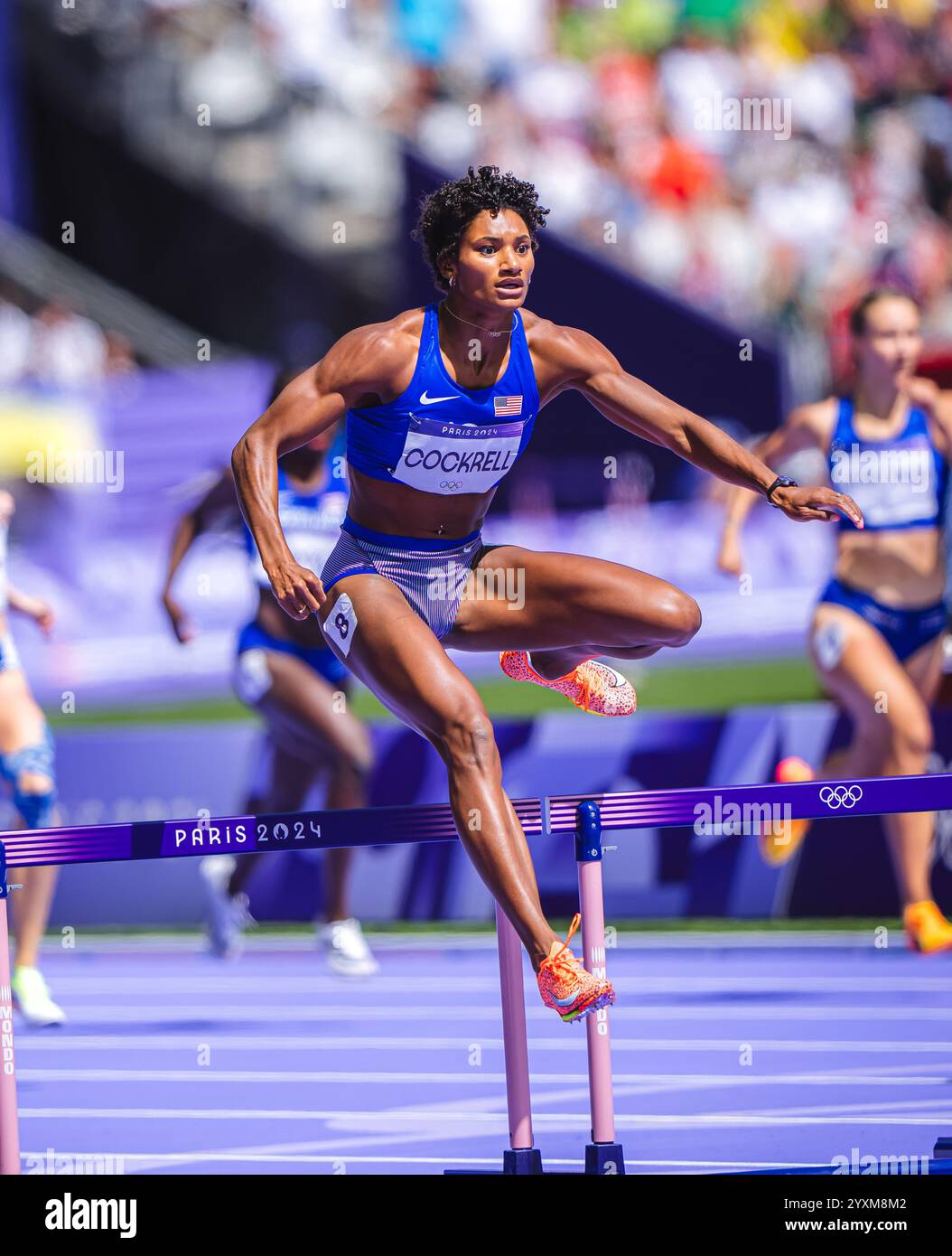 Anna Cockrell participating in the 400 meters hurdles at the Paris 2024 ...