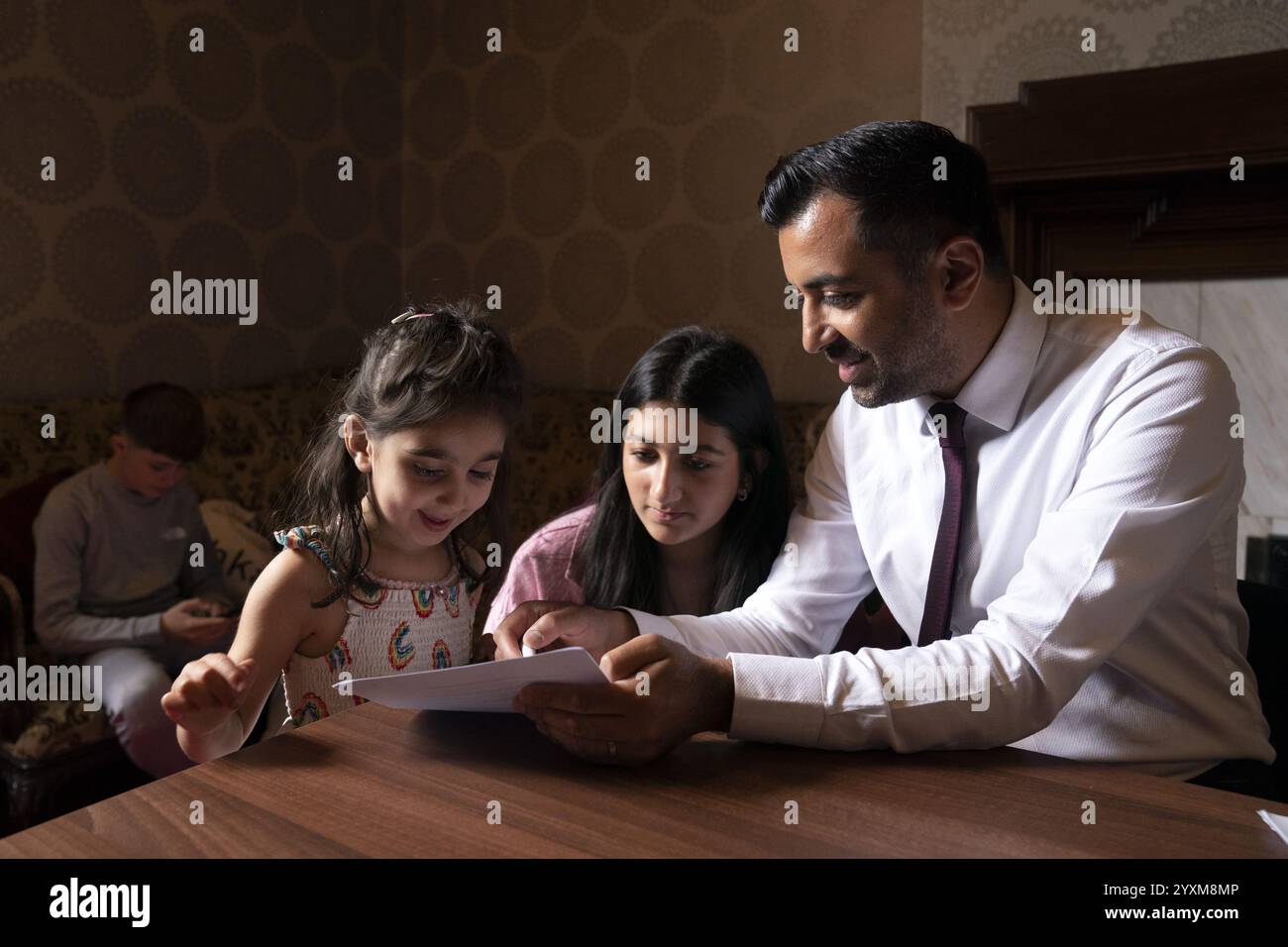 File photo dated 24/06/23 of First Minister Humza Yousaf reading ...
