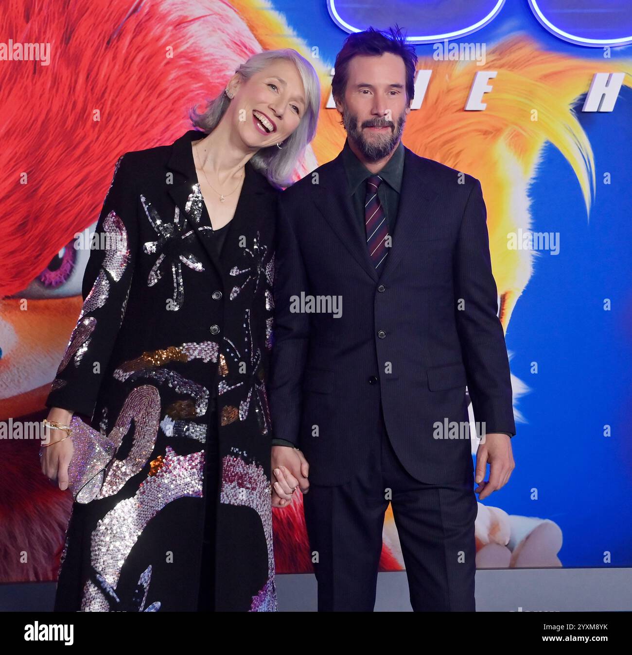 Cast member Keanu Reeves (R) and American visual artist Alexandra Grant ...