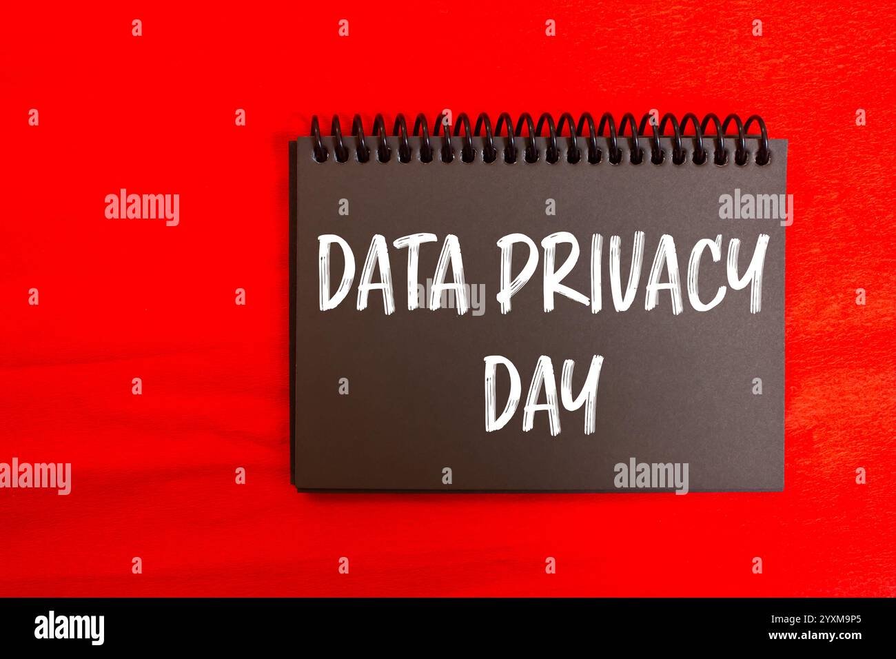 Data privacy day message written on black notebook page with red ...
