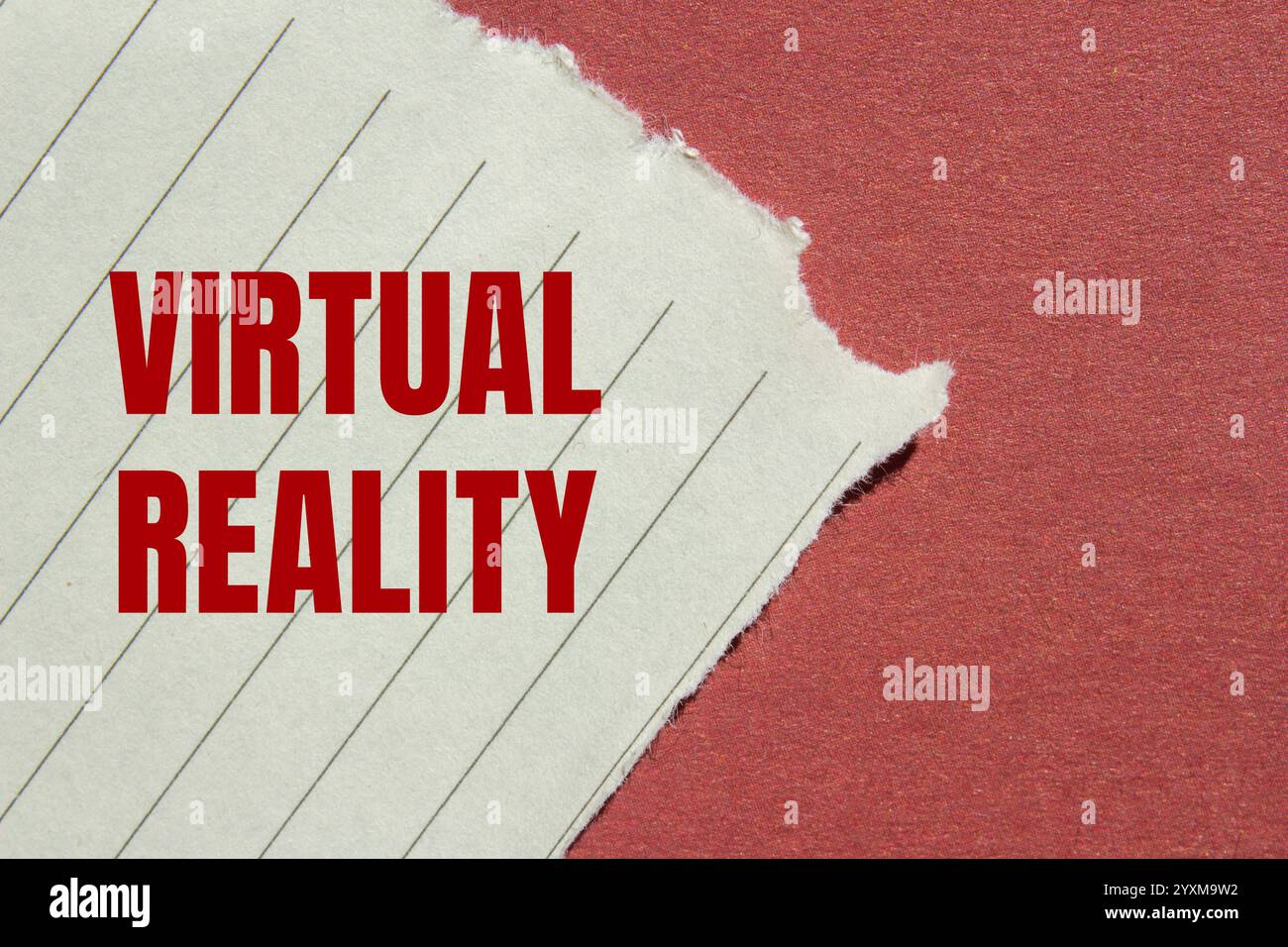 Virtual reality message written on ripped torn lined paper with red background. Conceptual ...