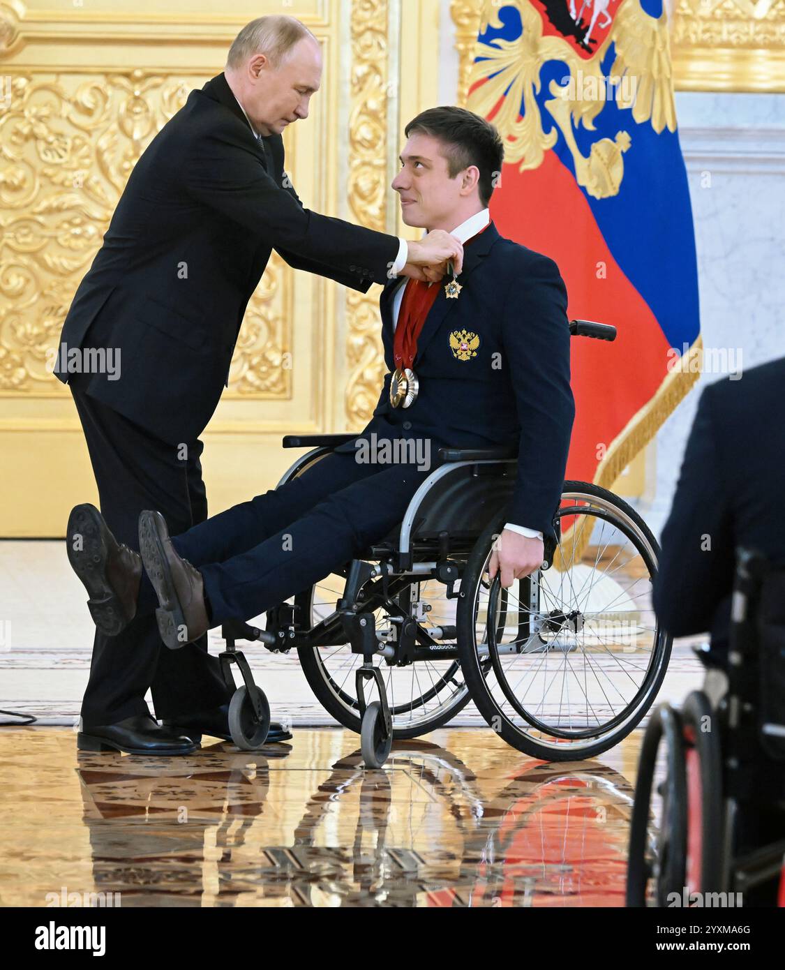 Russian President Vladimir Putin (left) and the 2024 Paralympic ...