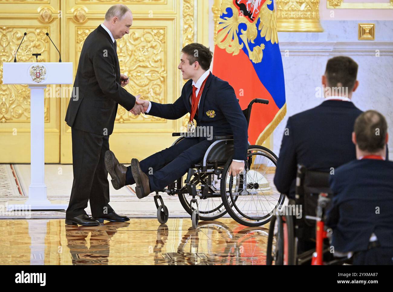 Russian President Vladimir Putin (left) and the 2024 Paralympic ...