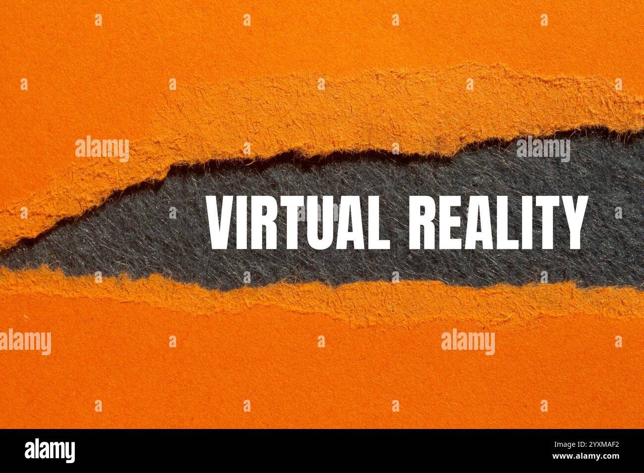 Virtual reality message written on ripped torn orange paper with gray ...