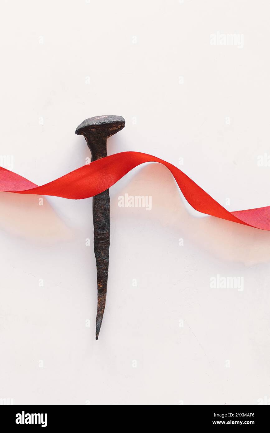 A nail with a red ribbon, a symbol of Christ. Crucifixion Of Jesus ...