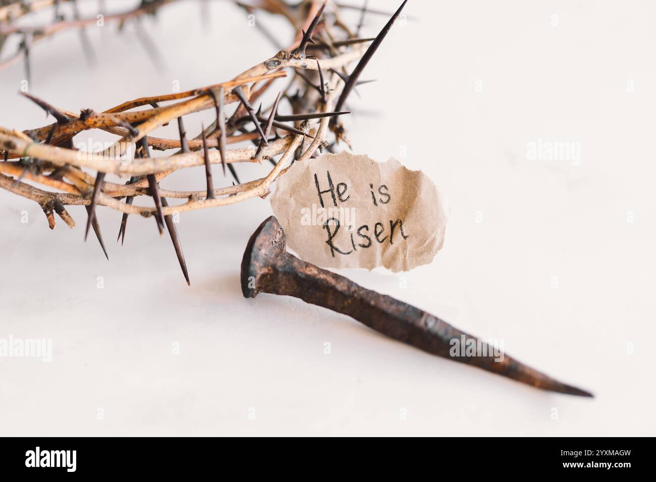 He is Risen. Jesus Crown Thorns and nails and cross on a white ...