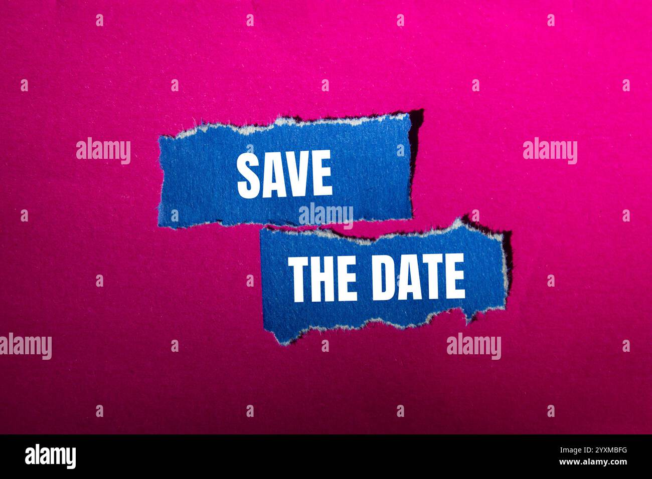 Save the date message written on ripped torn blue paper pieces with ...