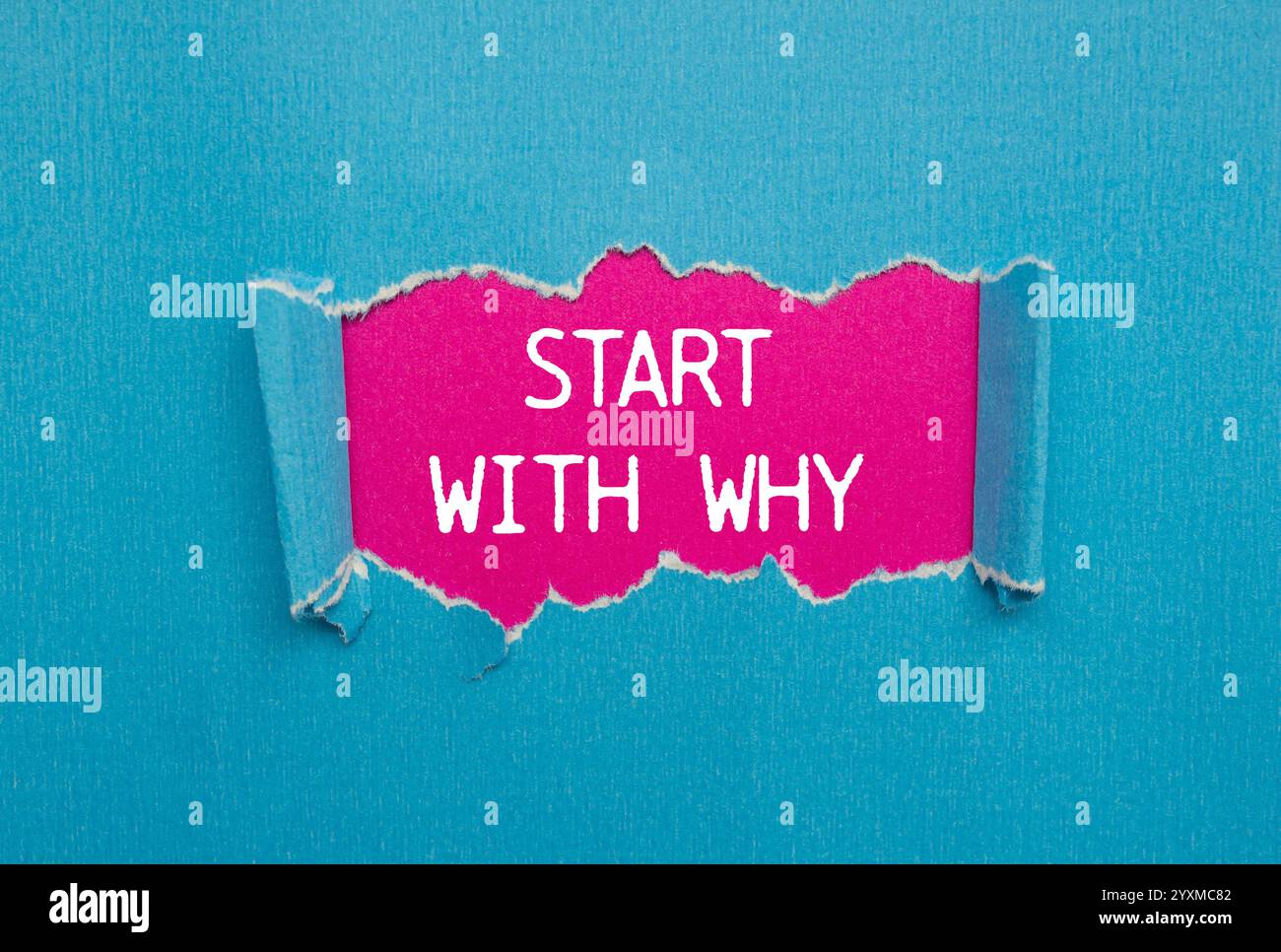 Start with why message written on ripped torn blue paper with pink background. Conceptual start ...