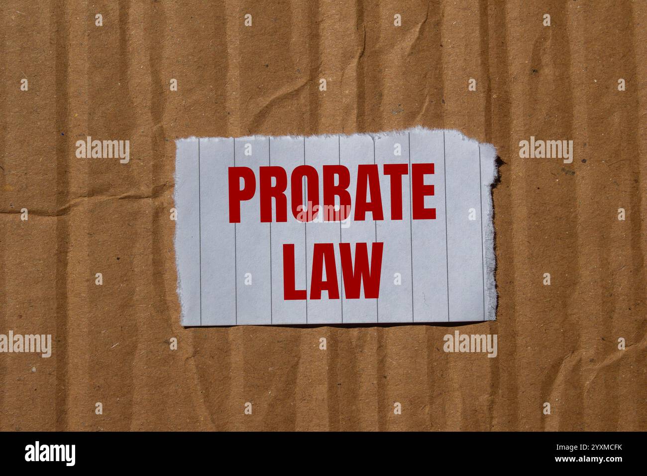 Probate law message written on ripped torn paper piece with cardboard ...