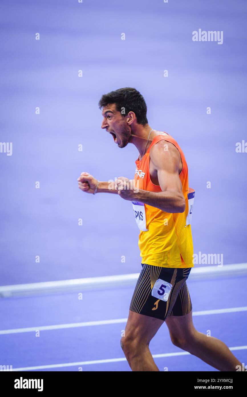 Enrique Llopis participating in the 110 meters hurdles at the Paris ...