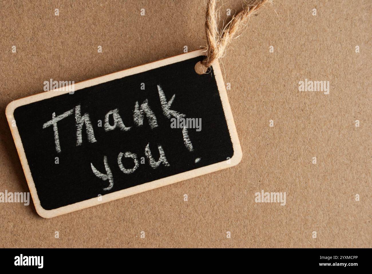 Handwritten thank you note on a small writing pad with chalk Stock ...
