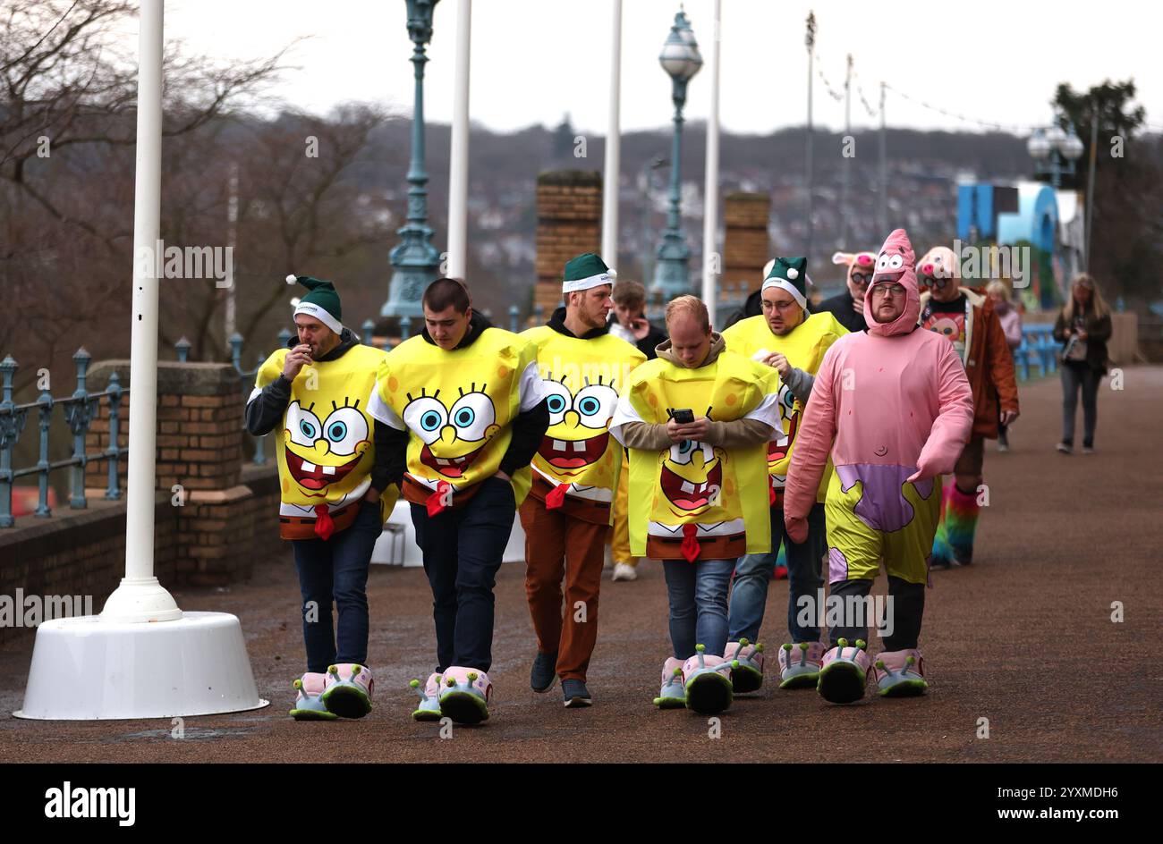 A general view of fans in fancy dress as they make their way to the ...