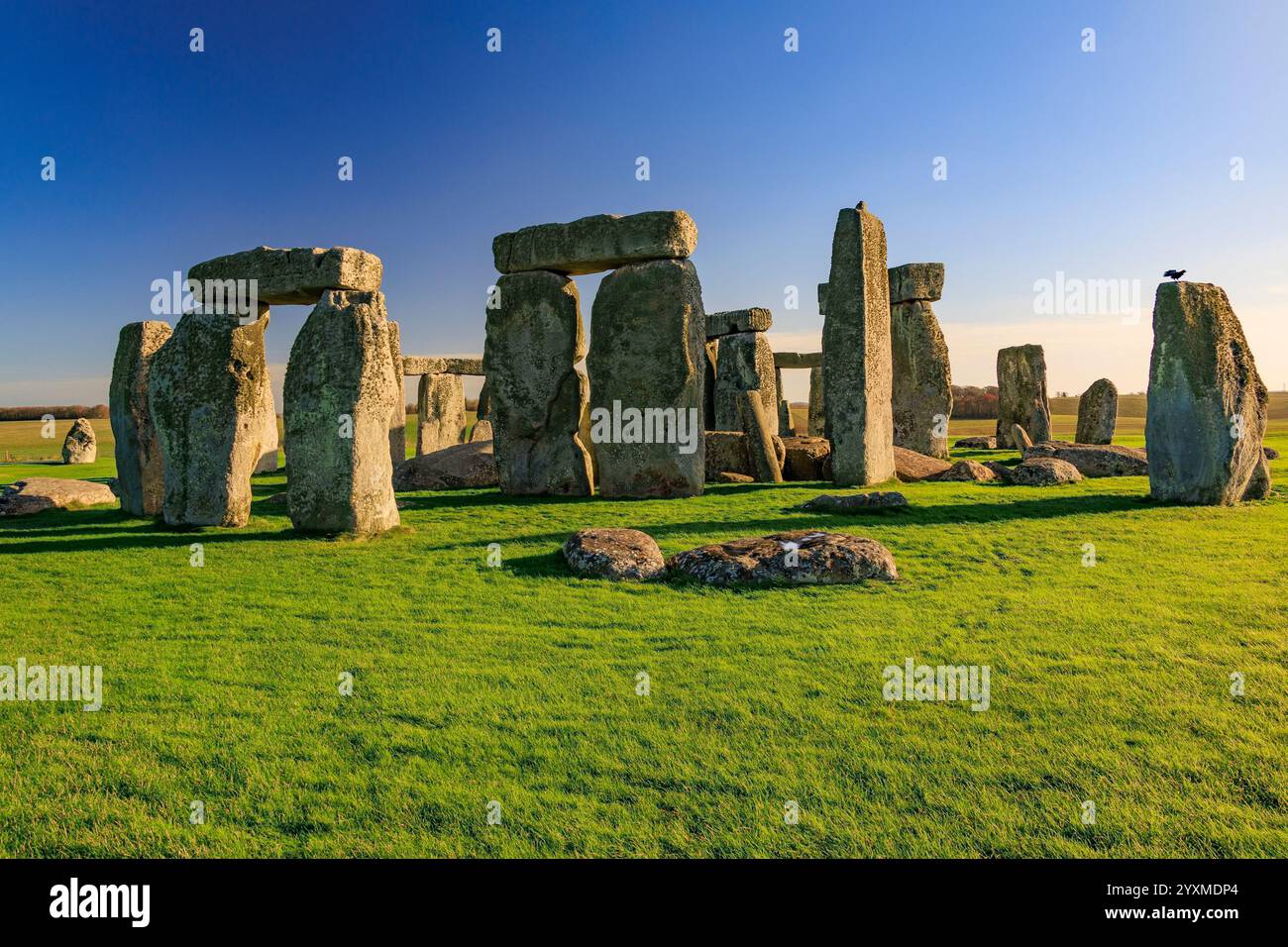 Winter sun at the prehistoric megalithic stone circle at Stonehenge on ...