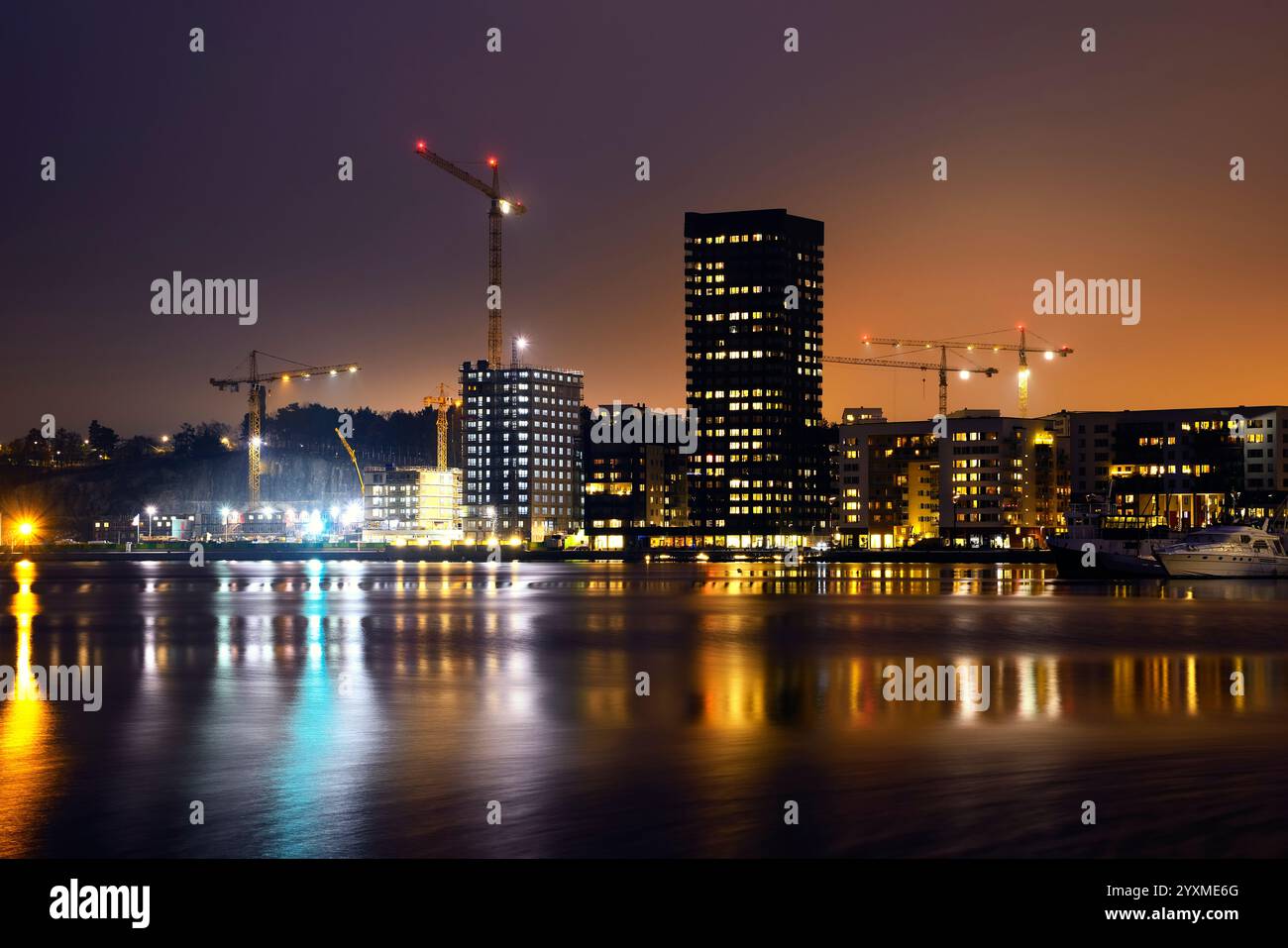 Night view of modern apartment buildings in new neighborhood Stock ...