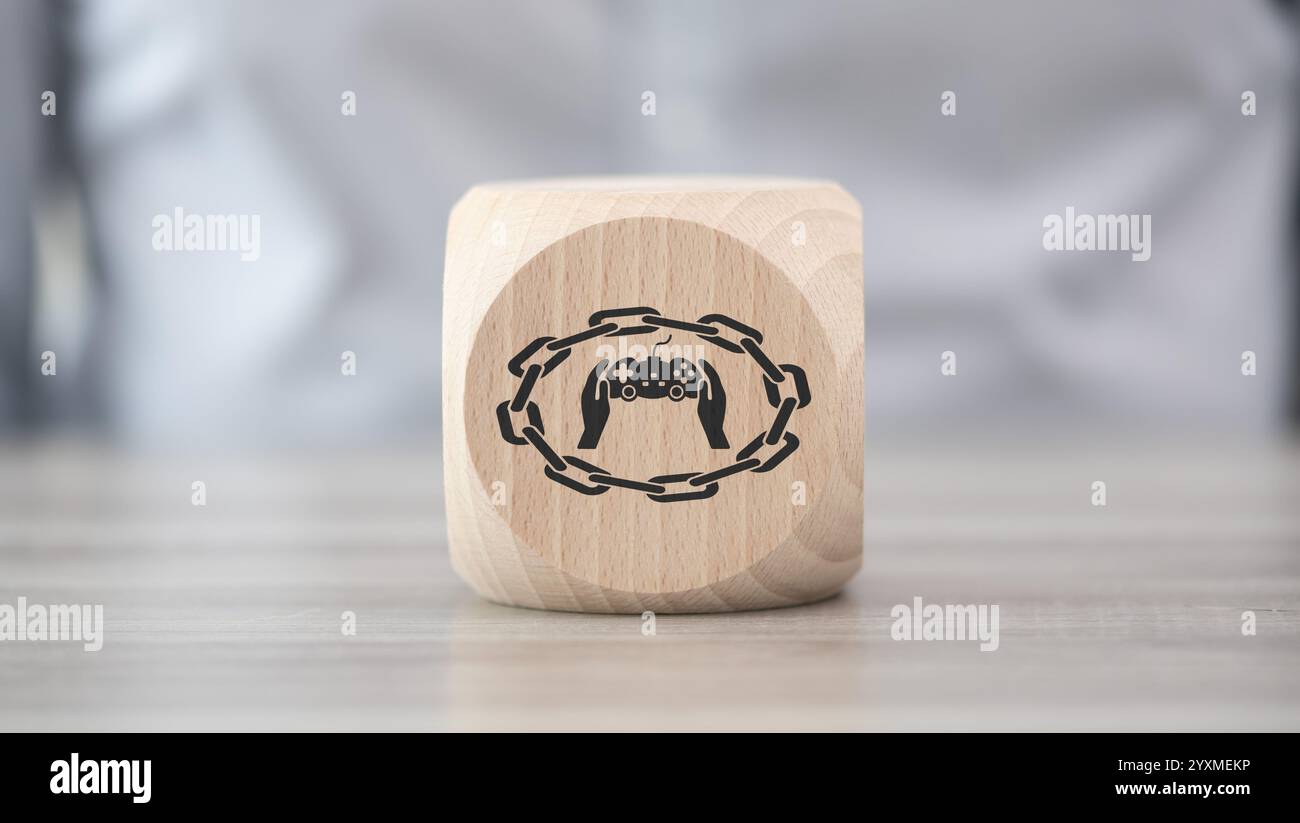 Wooden block with symbol of video game addiction concept Stock Photo ...