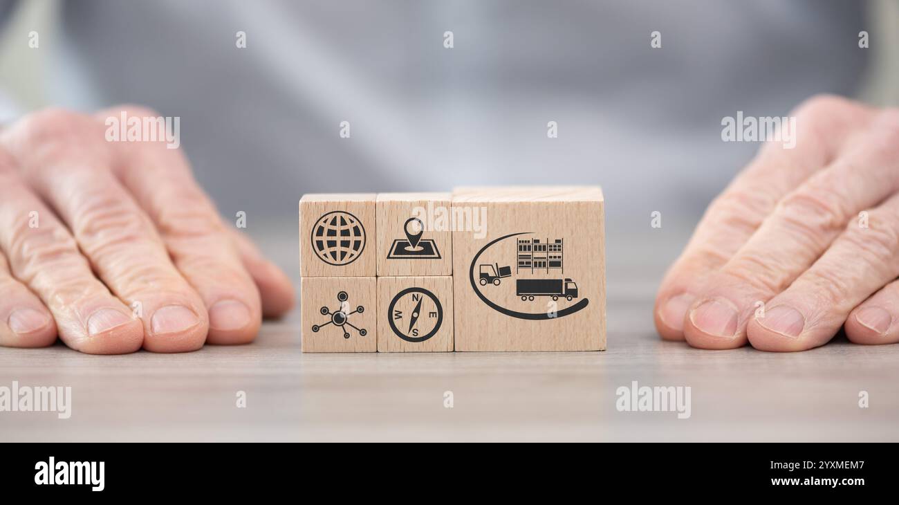Wooden blocks with symbol of logistics concept Stock Photo - Alamy