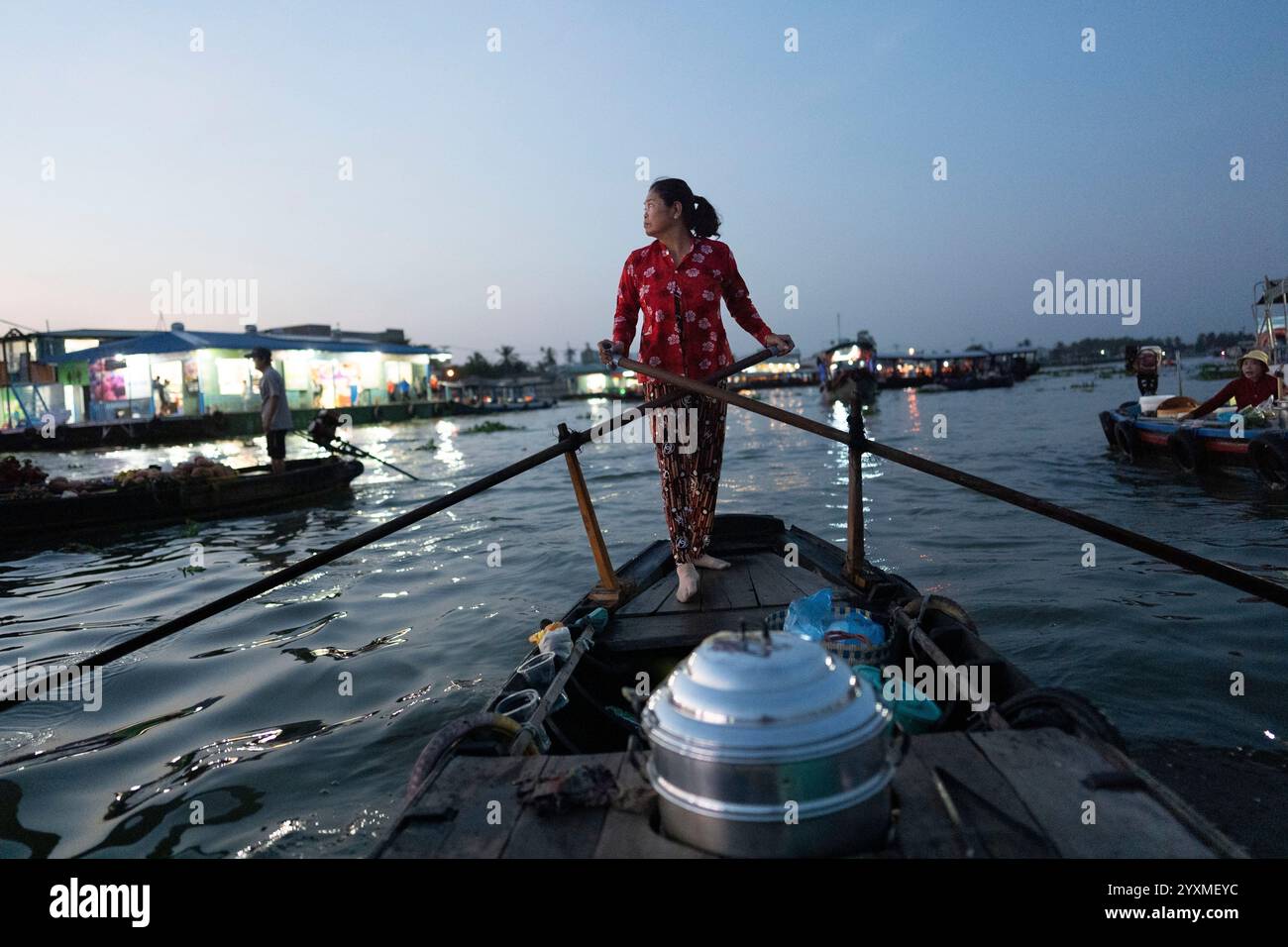 Nguyen Thi Thuy, a vendor who sells steamed buns on a floating market ...