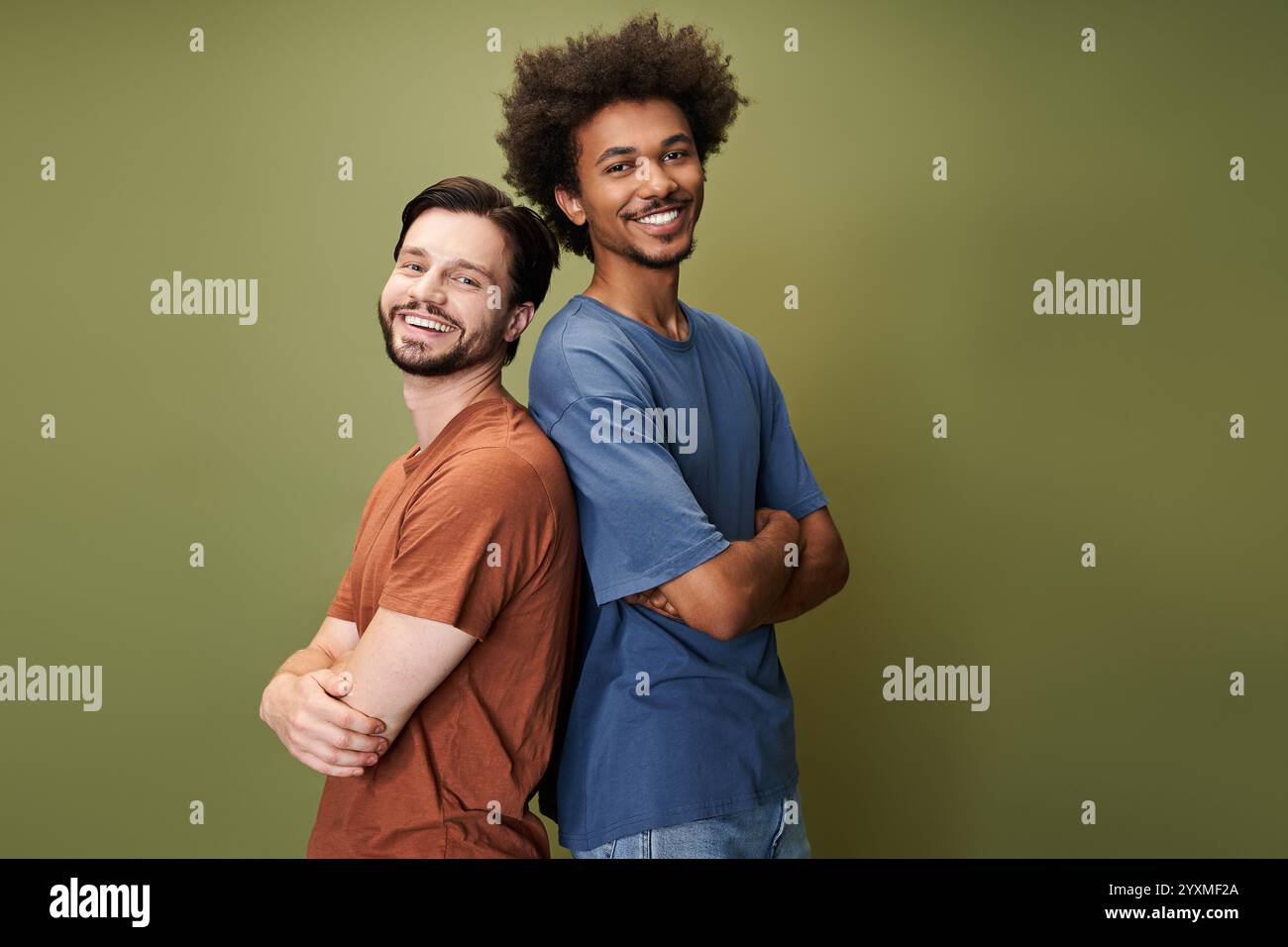 Two friends stand back to back, beaming with happiness in a colorful ...