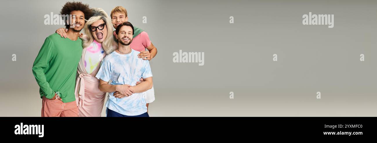 Cheerful group of queer friends posing together in colorful outfits ...