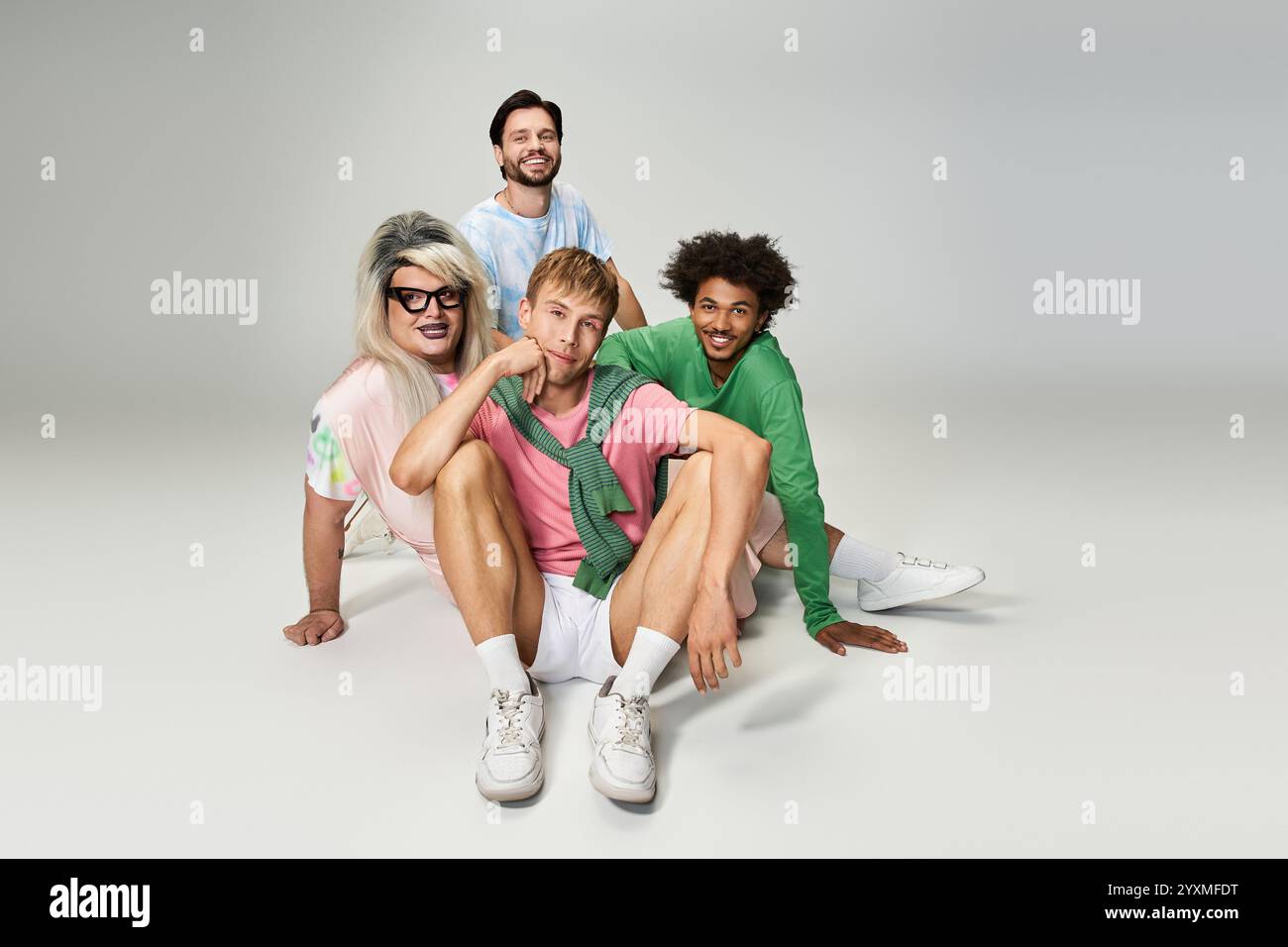 A diverse group of friends showcases vibrant outfits, embodying joy and ...