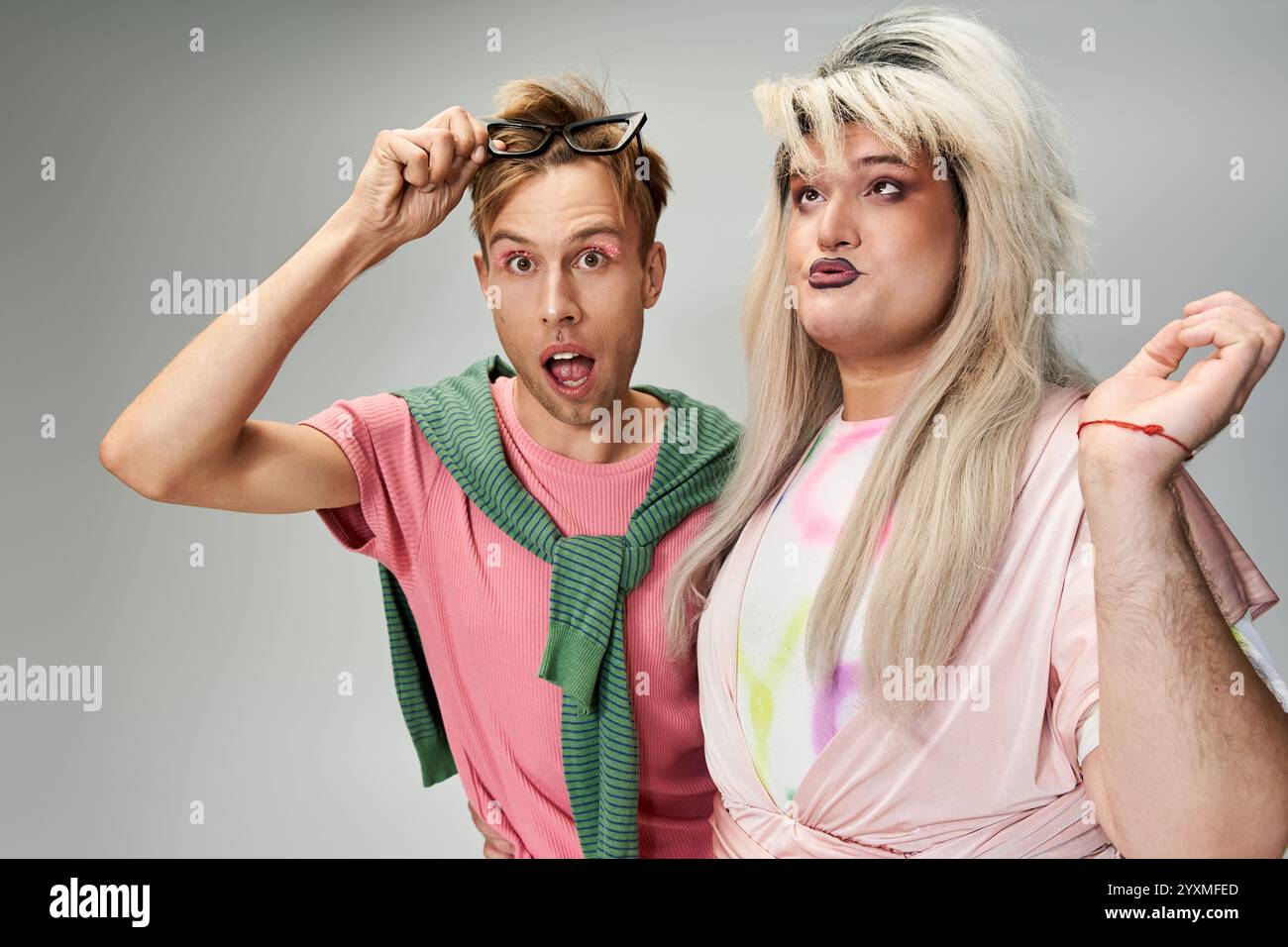 Two individuals showcase their vibrant style and confidence in a ...