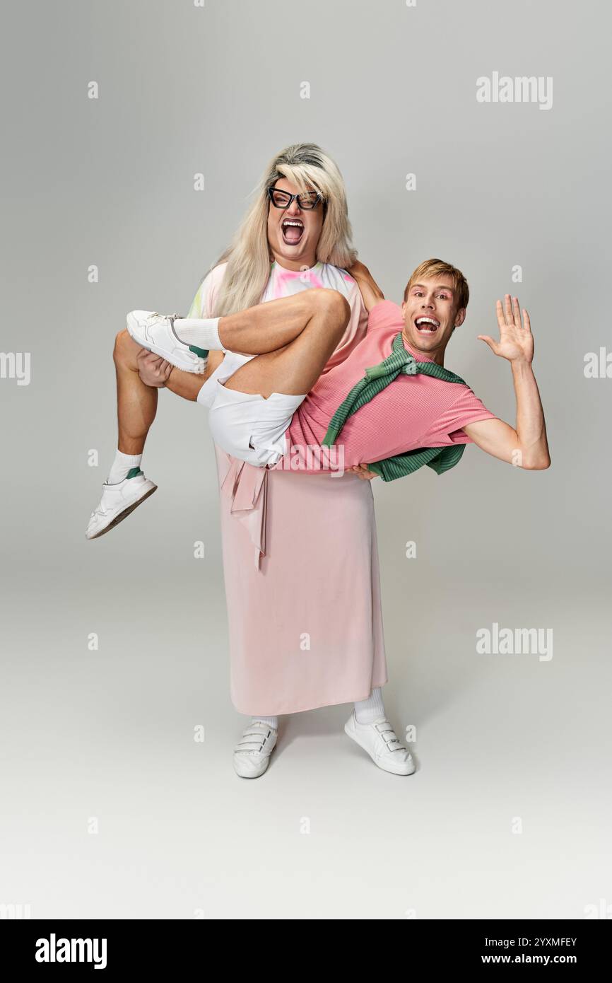 Two people celebrate pride with joyful smiles and vibrant outfits ...