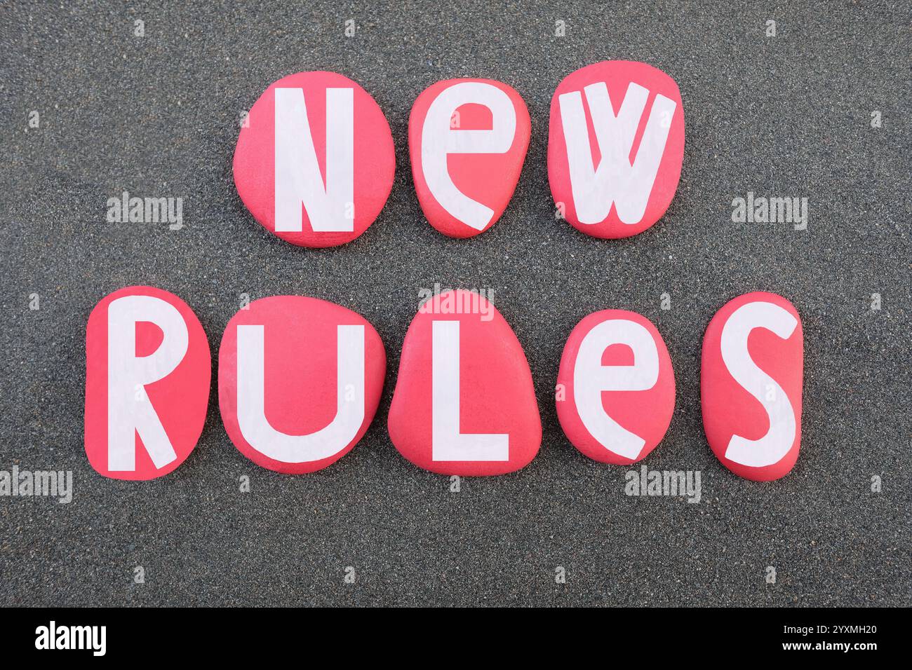 New rules, creative social message composed with red hand painted stone ...