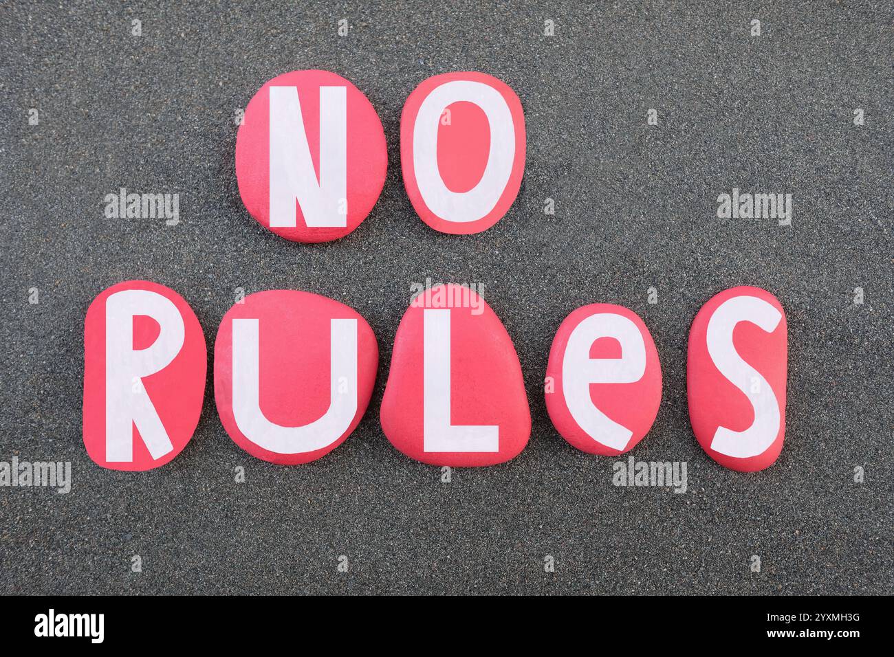 No rules, creative slogan composed with hand painted red colored stone letters over black ...