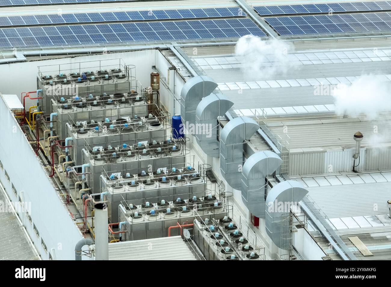 Sustainable industrial rooftop. Aerial view showcasing solar panels ...