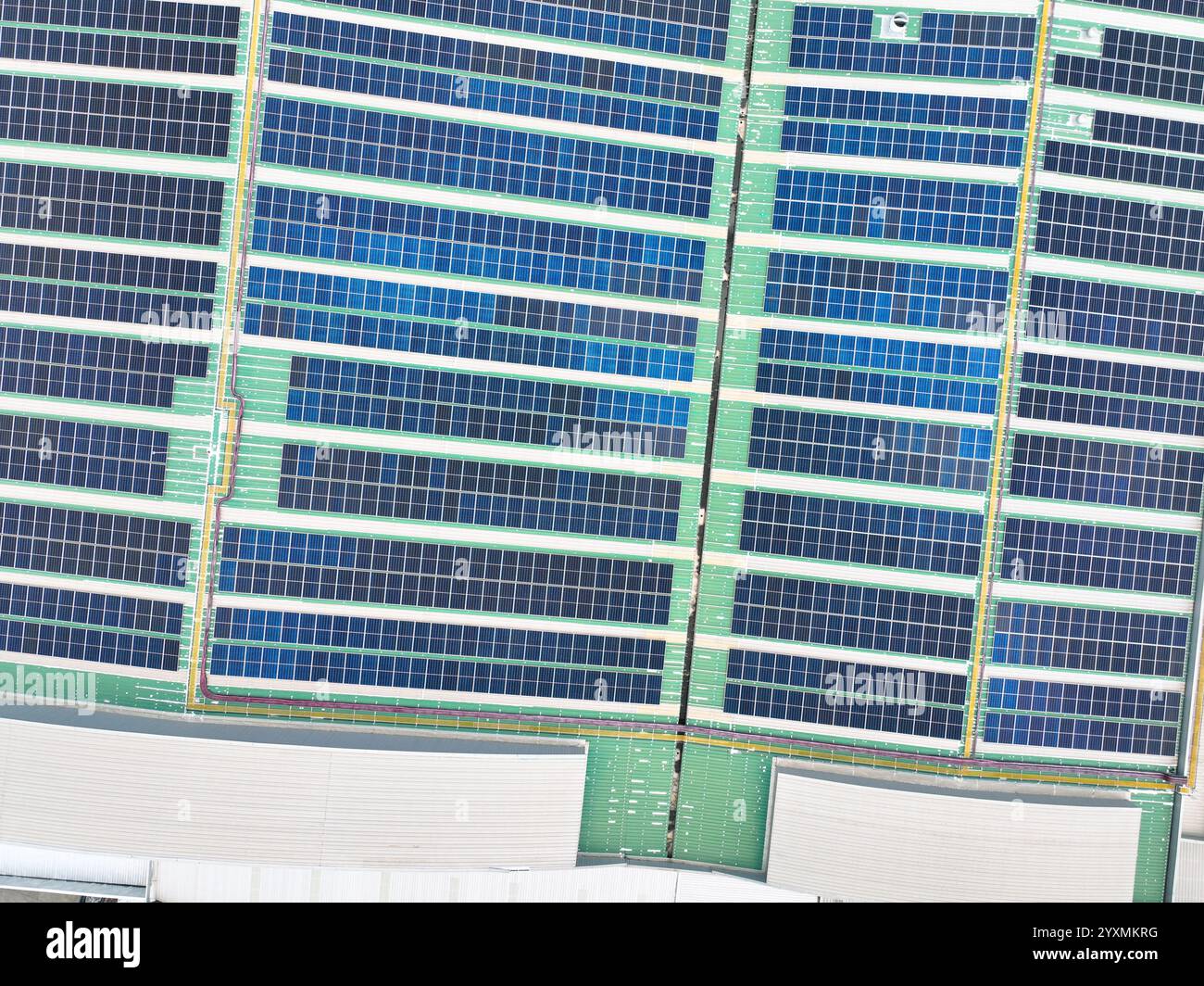 Solar energy system installed on the rooftop of an industrial factory ...