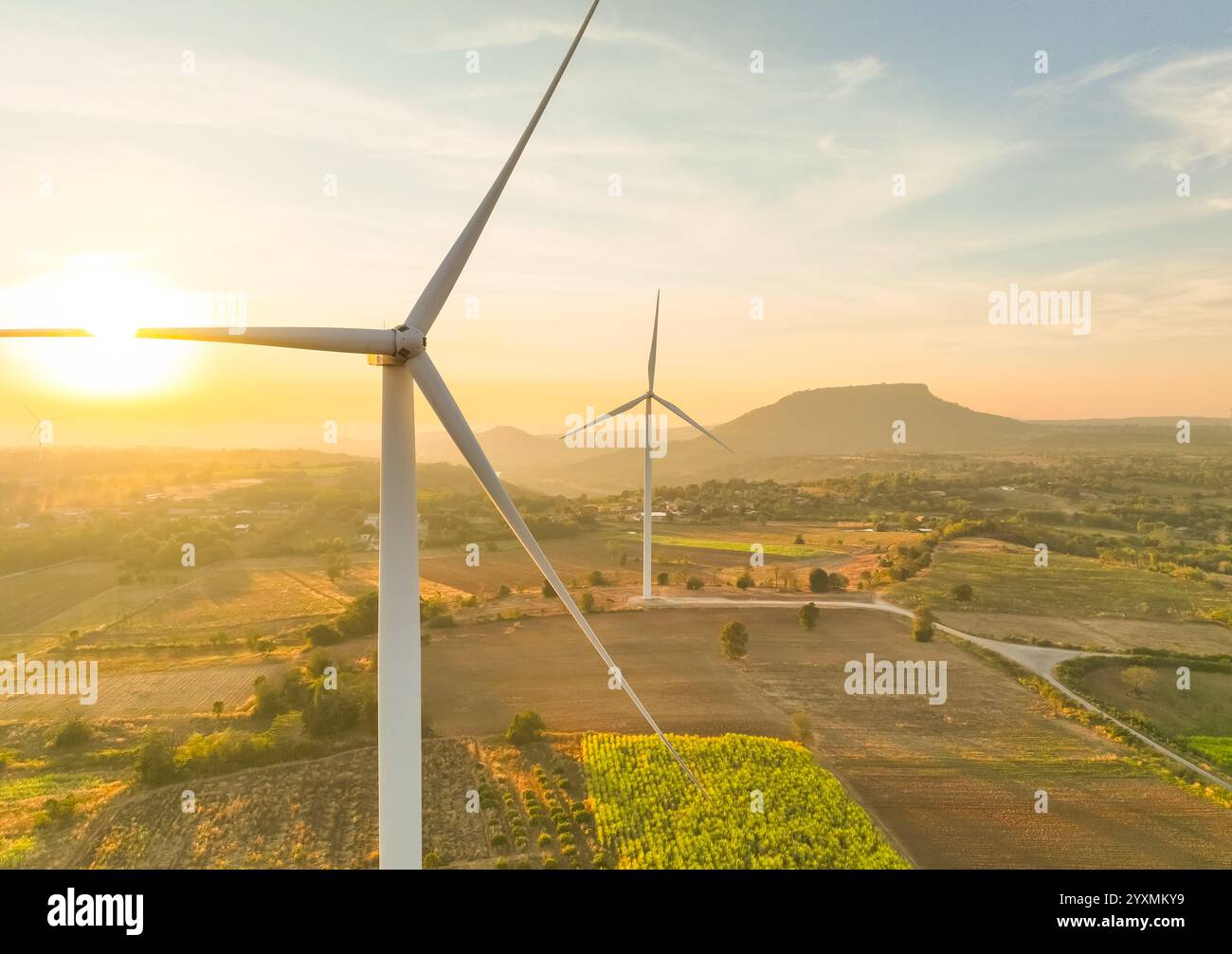 Wind farm field and sunset sky. Wind power. Sustainable, renewable ...