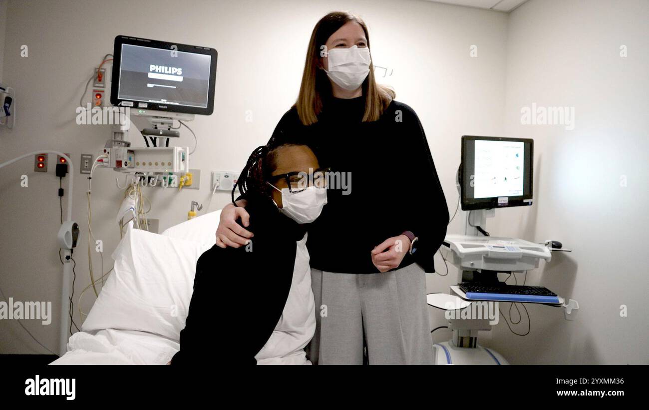 Pig kidney recipient Towana Looney sits with transplant surgeon Dr ...