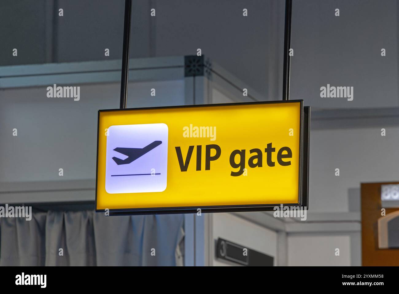 Illuminated Vip Gate Yellow Sign Hanging from Ceiling at Airport Stock ...