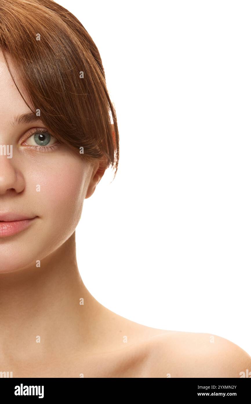 Half-face portrait of attractive young woman demonstrating her perfect ...
