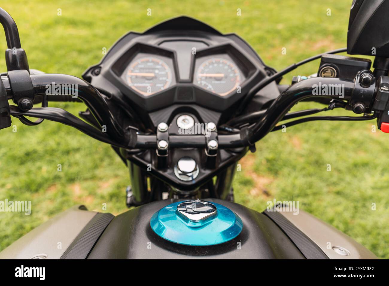 Black motorcycle dashboard on a sunny day with a cloudy sky Stock Photo ...