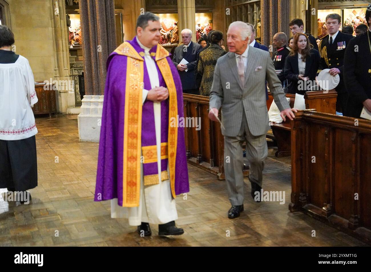 King Charles III with parish priest Rev Dominic Robinson SJ, during an ...