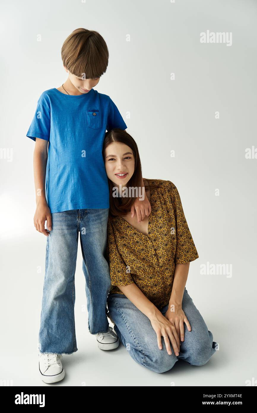A young mother kneels beside her son, radiating warmth and connection ...
