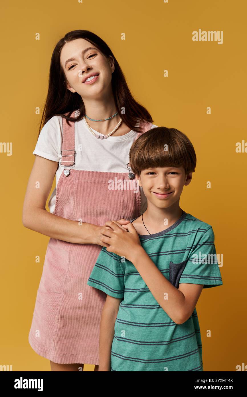 Young mother and her son share a warm moment in a vibrant studio ...