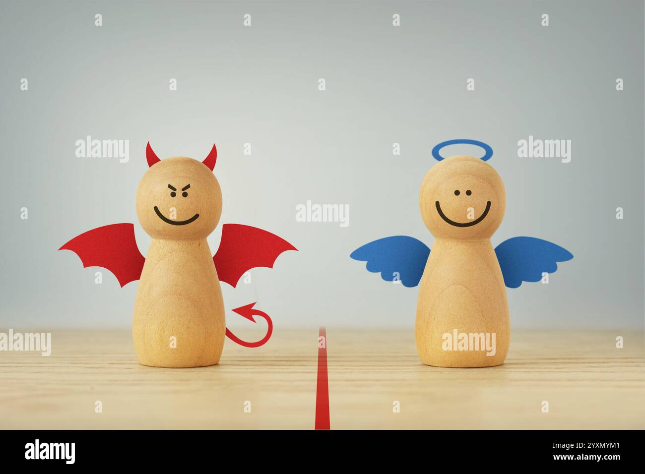 Devil and angel wooden pawn - Good and evil concept Stock Photo - Alamy