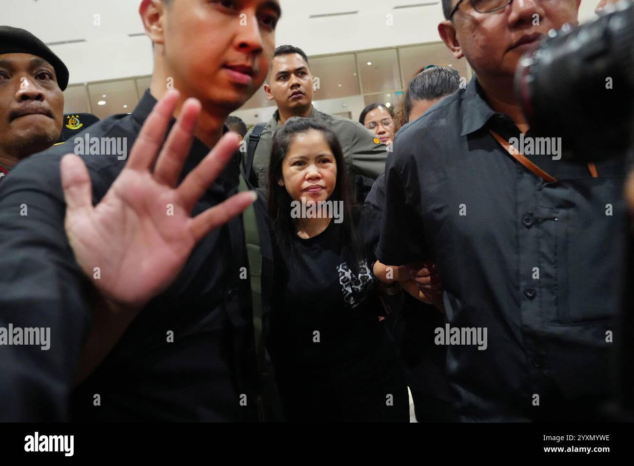 Mary Jane Veloso, center, a Filipina who was on death row in Indonesia and was nearly executed ...