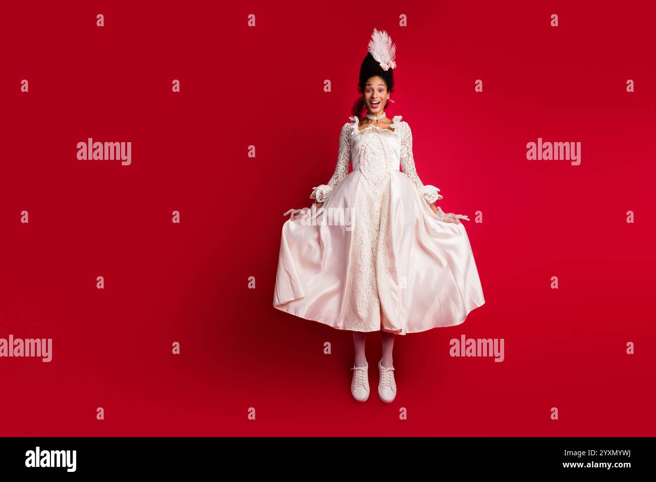 Photo of positive lady princess queen jumping touch dress isolated red ...