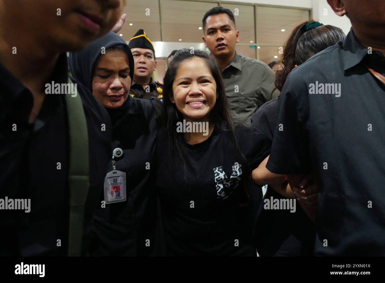 Mary Jane Veloso, center, a Filipina who was on death row in Indonesia and was nearly executed ...